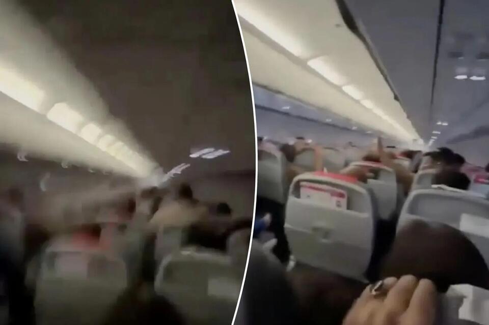 Dramatic video shows cabin chaos and screams as plane is hit by extreme ...