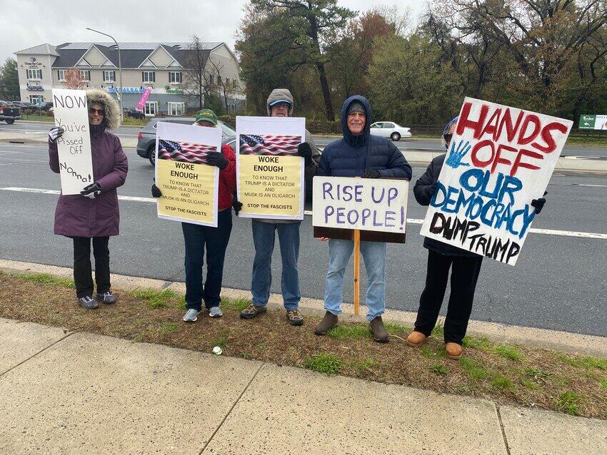 GALLERY: Hundreds of protestors brave rain, cold to line Coastal Hwy ...