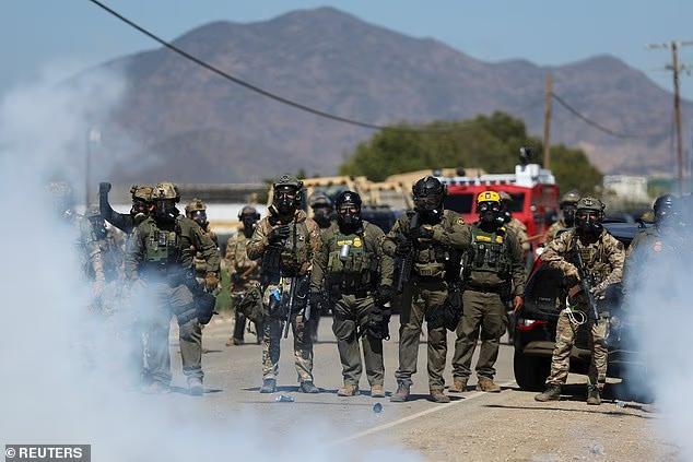 California professor unmasked as protester who 'hurled tear gas at ICE ...