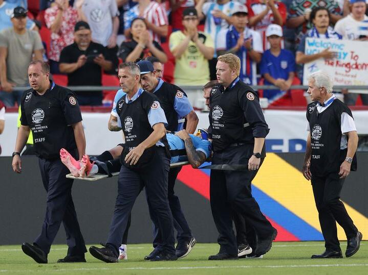 Uruguay player carried off field in neck brace after horror injury vs ...