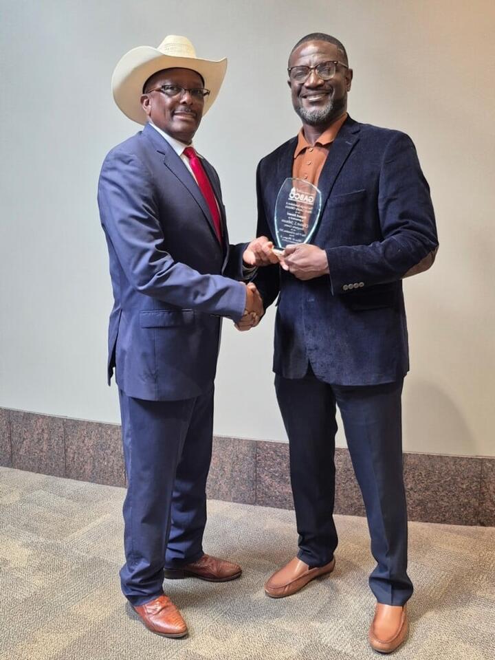 Commissioner and ACCG President Clinton Johnson receives the Rising ...