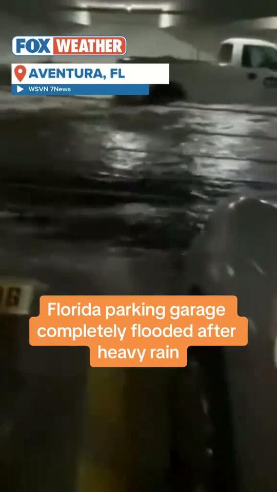 COMPLETELY FLOODED A parking garage in Aventura FL was filled with ...