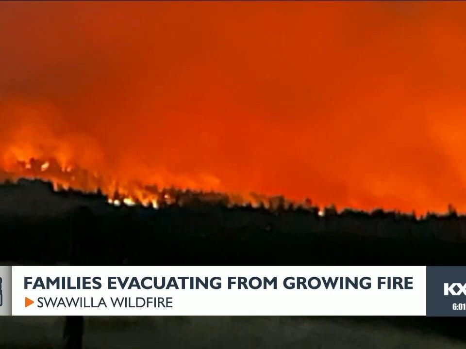 Families evacuating from growing Swawilla Fire
