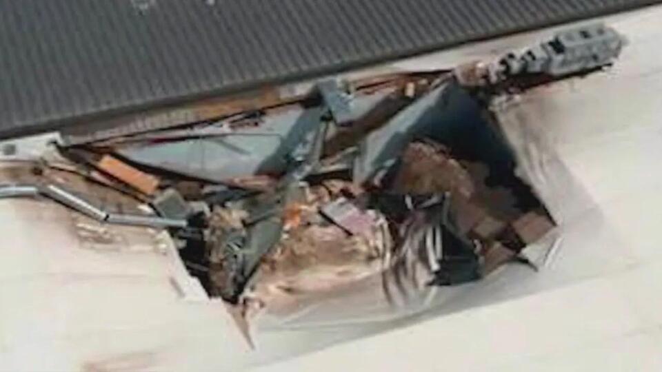 Roof collapses on workers during storm - NewsBreak