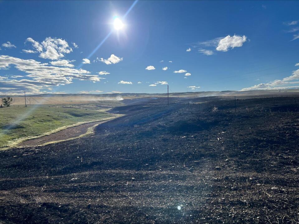 Portion of Highway 87 temporarily closed due to large grassfire
