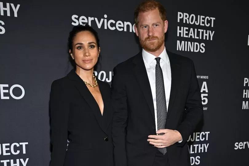 Meghan Markle stuns in chic black suit as she holds hands with Prince ...