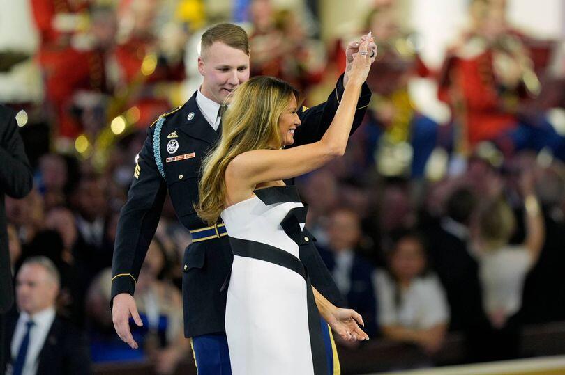 Melania Trump beams as she's twirled on stage by uniformed officer after 'awkward' dance with ...