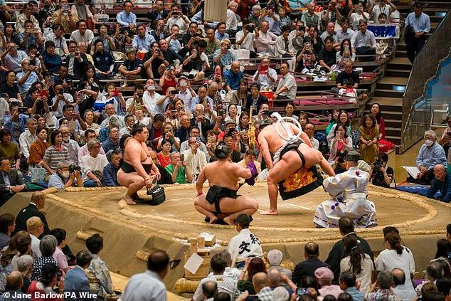 Sophie watches a sumo wrestling match as she and Prince Edward kick off ...