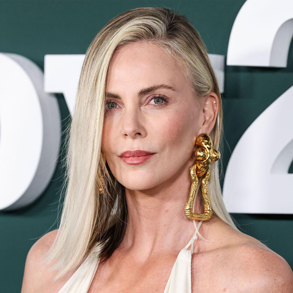 Fans Say Charlize Theron Looks Amazing As She Shows Off Her Long Legs