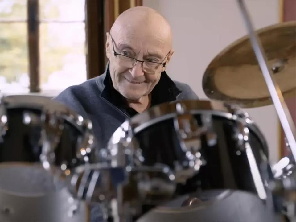 Watch Phil Collins Sit Down at Drum Set for First Time in Years - NewsBreak