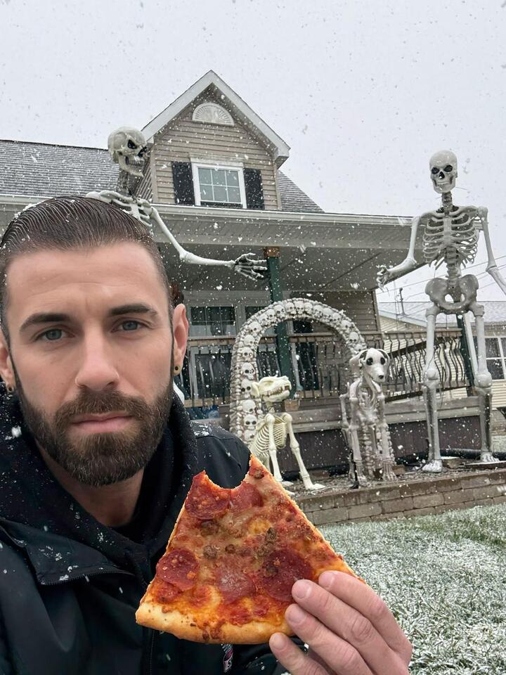 Michigan man is on a mission to eat pizza next to oversized skeletons ...