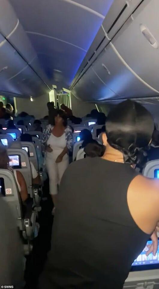 Scary moment plane passenger tries to open cabin doors at 30,000ft in ...