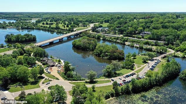 Residents of America's iconic 'Tree Town' fume as power company goes on ...