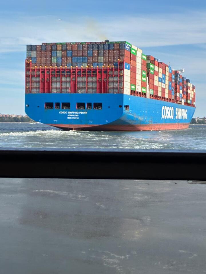 Video: Jaw-dropping moment for ferry riders as towering container ship ...