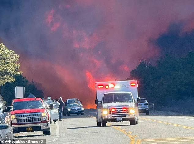 Evacuations ordered as 'fast-moving' wildfire erupts in wealthy ...