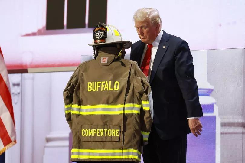 Trump poses with uniform of firefighter killed at rally with misspelled ...