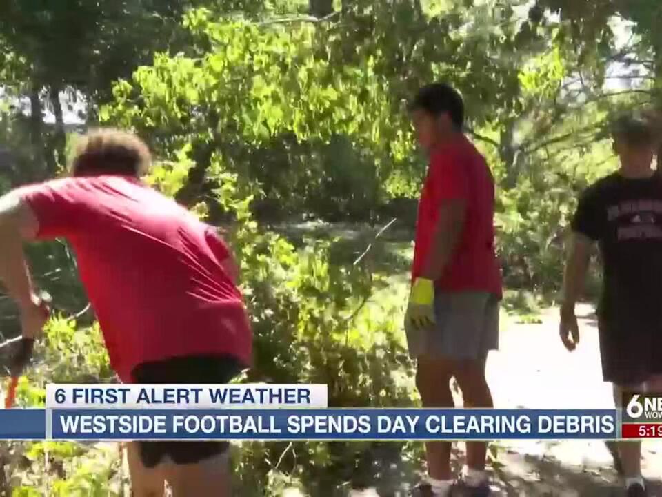 Omaha storm cleanup: Westside Highschool football team clear debris