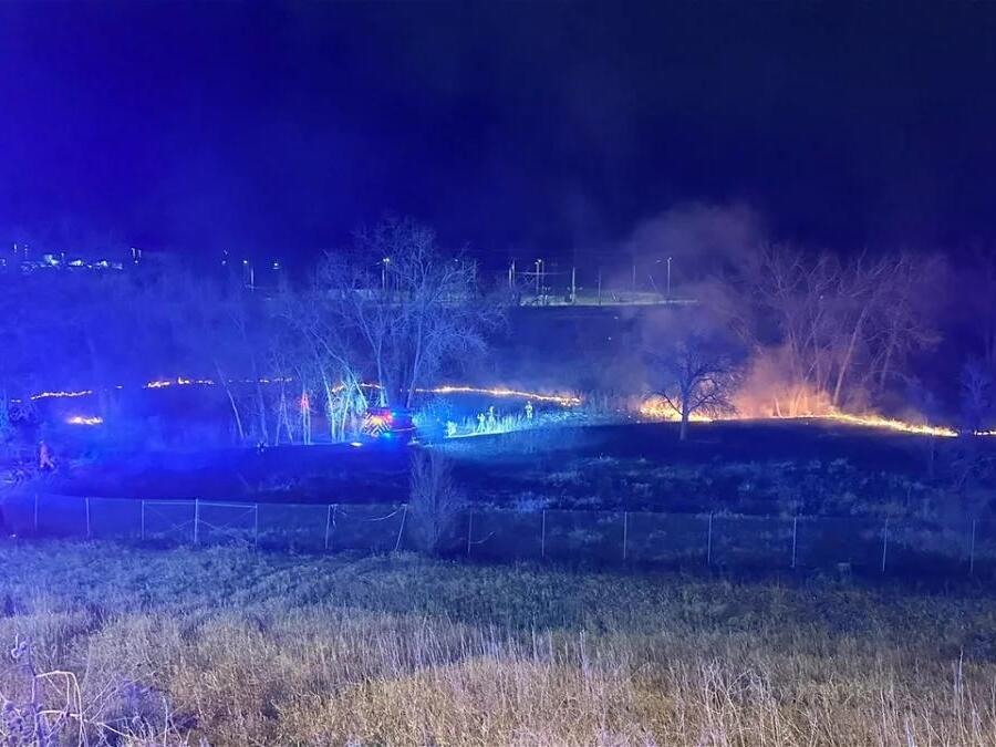 Multiple Colorado Springs fire crews battling a two-acre grass fire