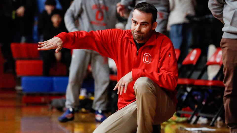 Wrestler taken away in ambulance, teammate punched in face during ...