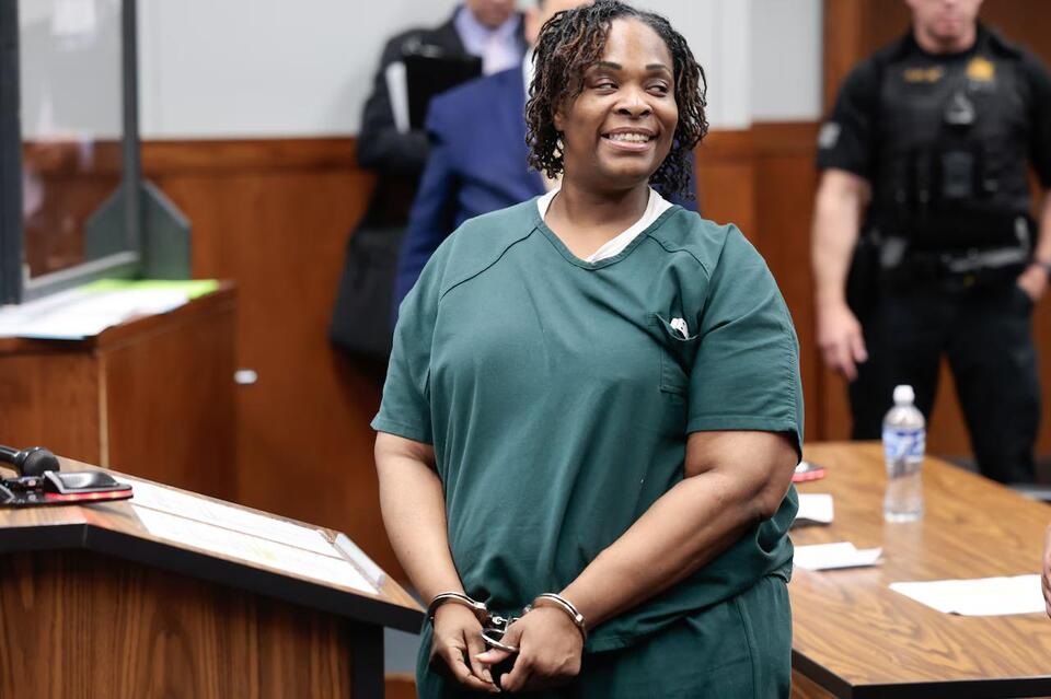 Woman accused of murder of foster family reveals message on T-shirt ...