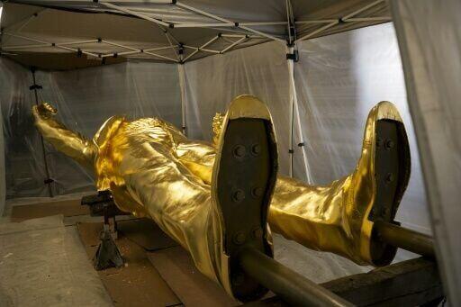 Floored: the 15-foot (4.5-metre) bronze statue coated with a thick ...