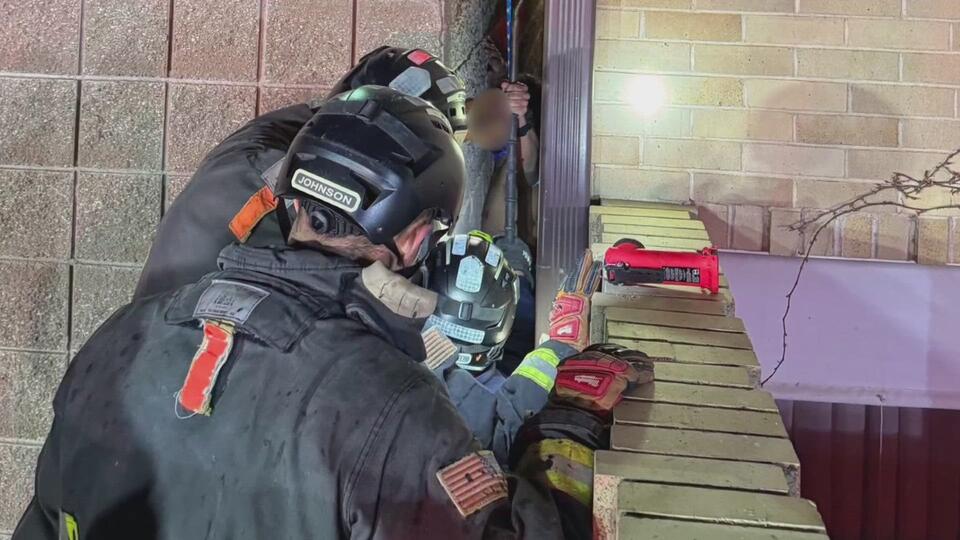 Man rescued after being trapped between walls for nearly 20 hours in ...