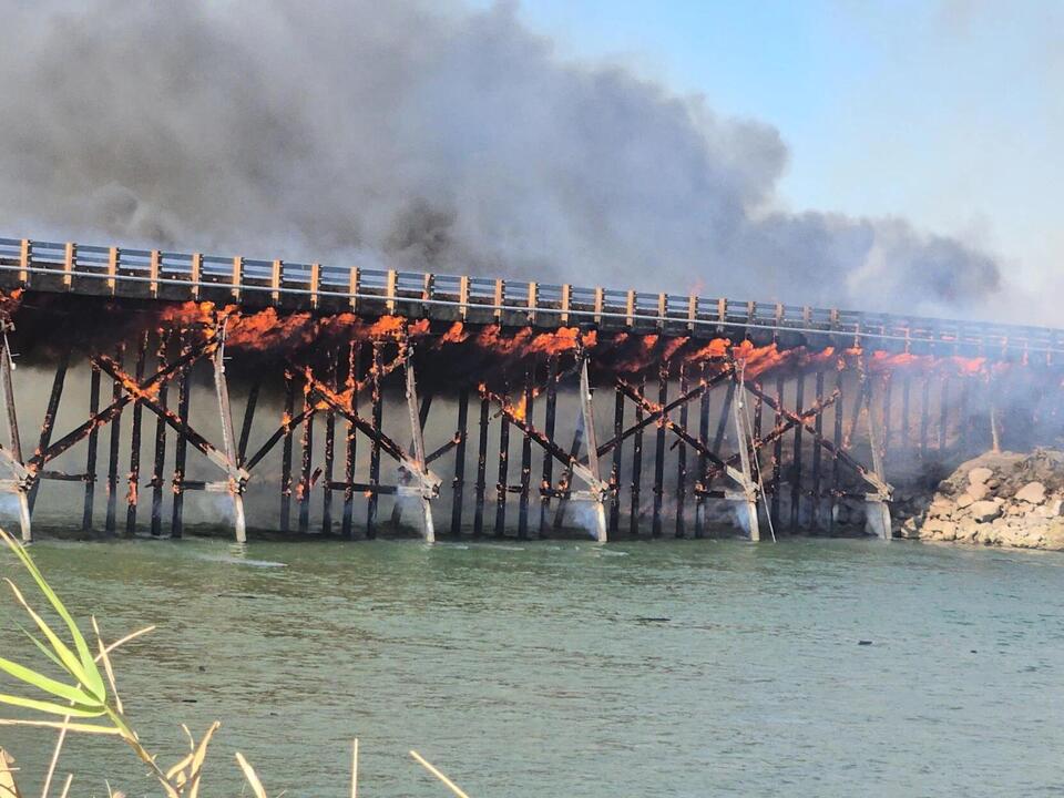 'It's completely gone': Oxbow Bridge destroyed in fire, collapses into ...