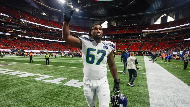 Report: Left tackle Charles Cross agrees to 4-year extension with ...