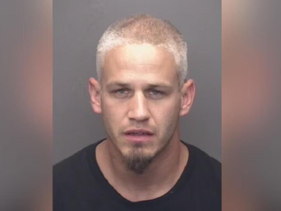 Suspect accused of firing gun at man, shattering glass door