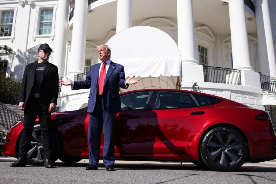At White House, Trump says he will buy Tesla in show of support for ...