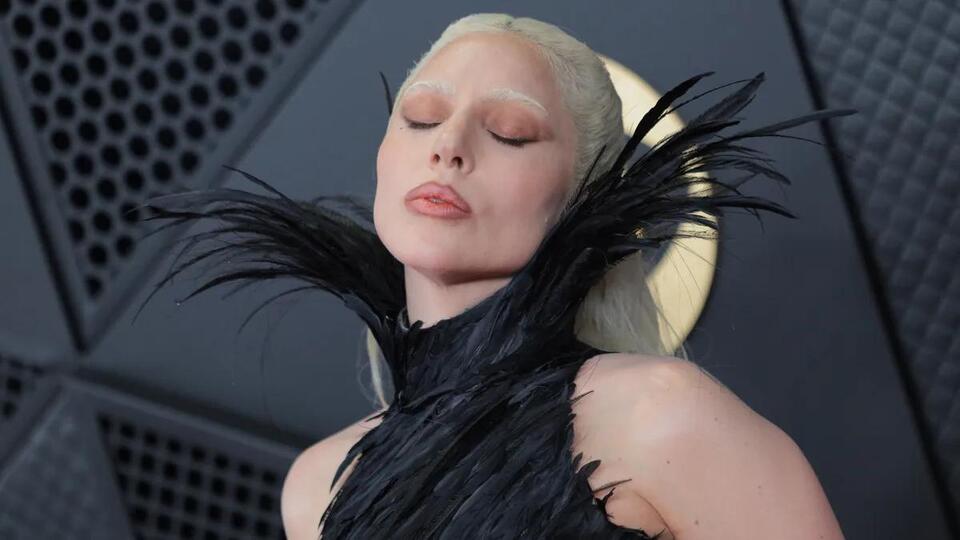 Lady Gaga brings feathers, dramatic flair to the 2026 Grammys red ...