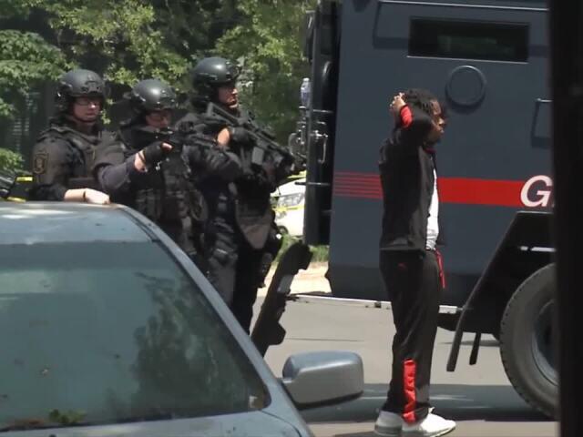 Standoff ends, suspect in custody in connection to loaded gun brought ...