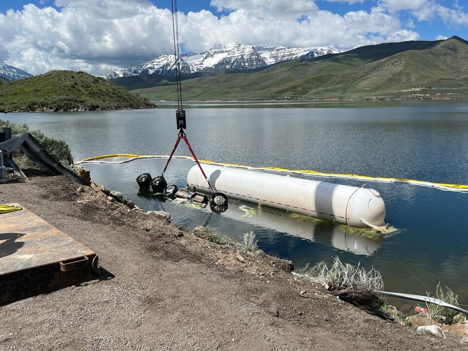 Driver missing after propane-hauling big rig crashes into Deer Creek ...