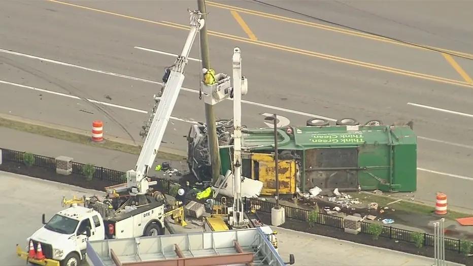 Lake Orion serious injury crash leaves garbage truck on its side, road ...