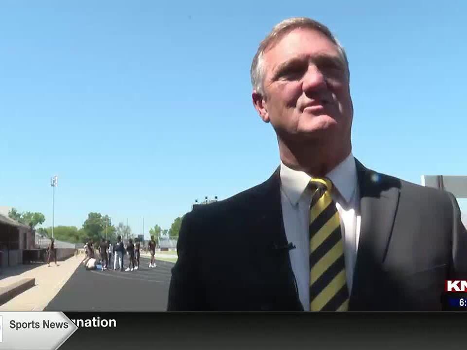 Neville introduces Mike Collins as new head football coach