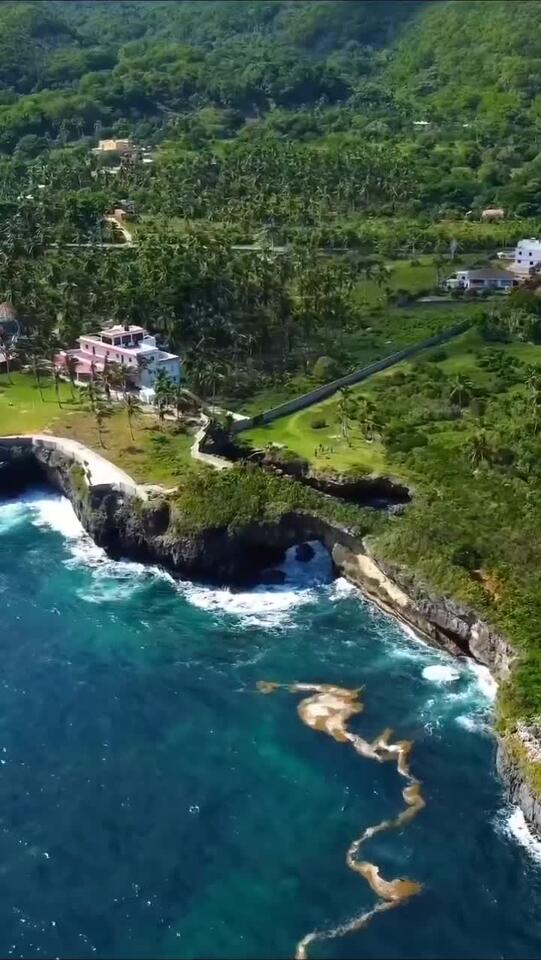 Soaring above the lush landscapes of Samana, Dominican Republic, with ...