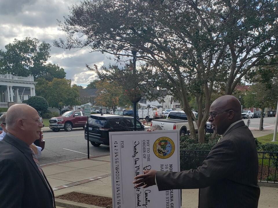 Ward hands out state checks for $44M in area projects