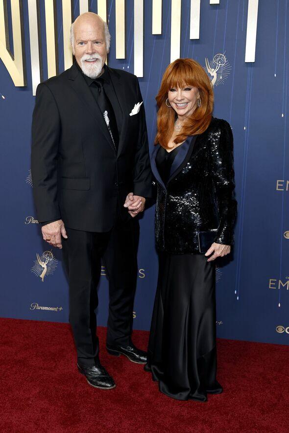 Reba McEntire and Rex Linn confirm engagement during Emmy Awards red carpet appearance - NewsBreak