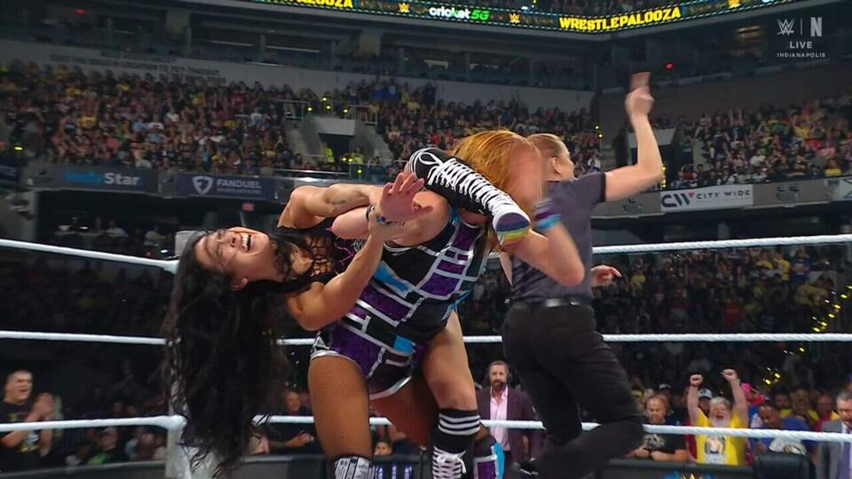 WWE Wrestlepalooza Results: AJ Lee Taps Out Becky Lynch In Return Match - NewsBreak